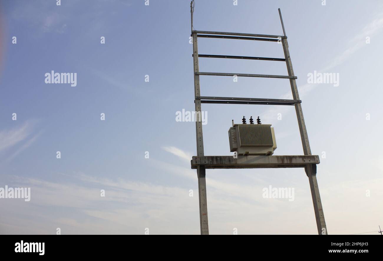 Close up the transformer on a concrete pole. Three-phase transformers ...