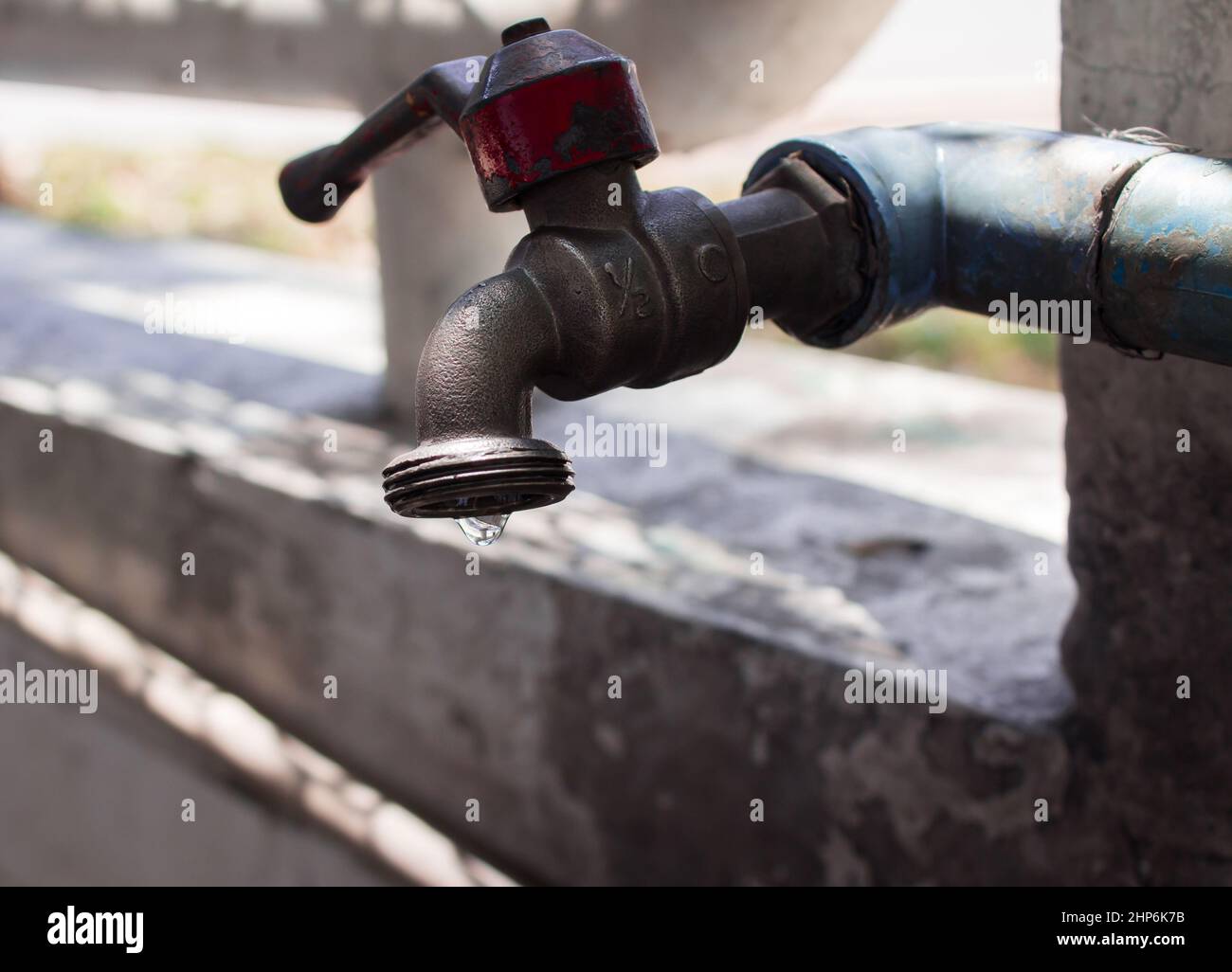 old faucet on concrete wall, save the water concept Stock Photo - Alamy