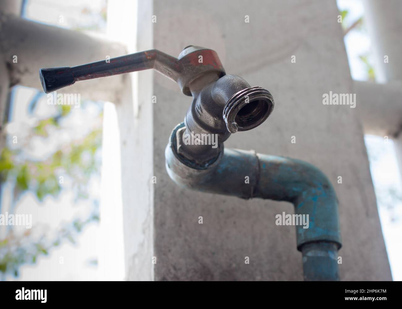 old faucet on concrete wall, save the water concept Stock Photo - Alamy