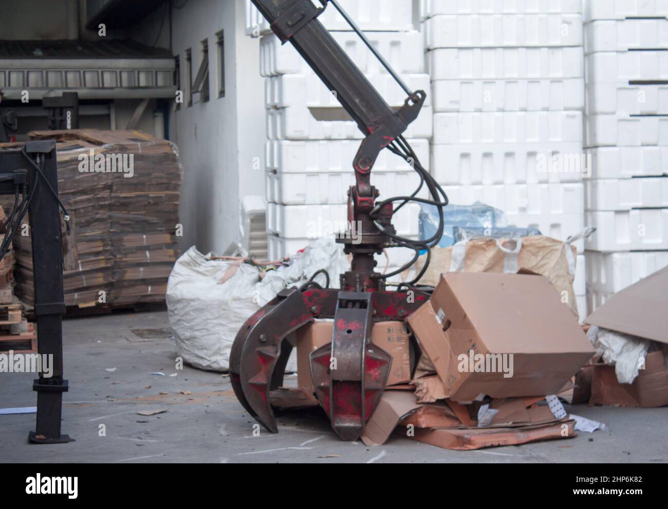 garbage truck with manual hydraulic. Claws of mechanical moving arm ...