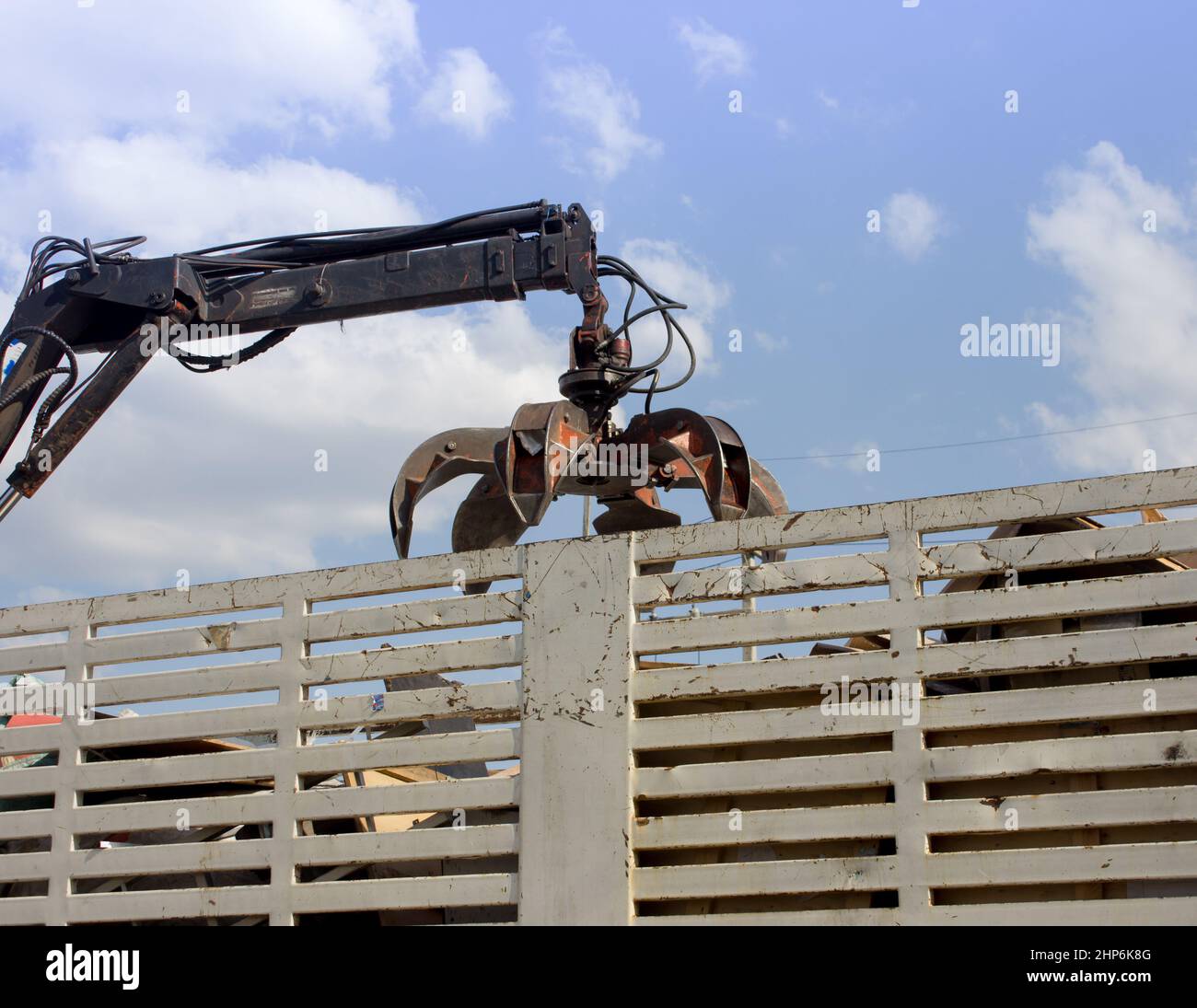 garbage truck with manual hydraulic. Claws of mechanical moving arm ...