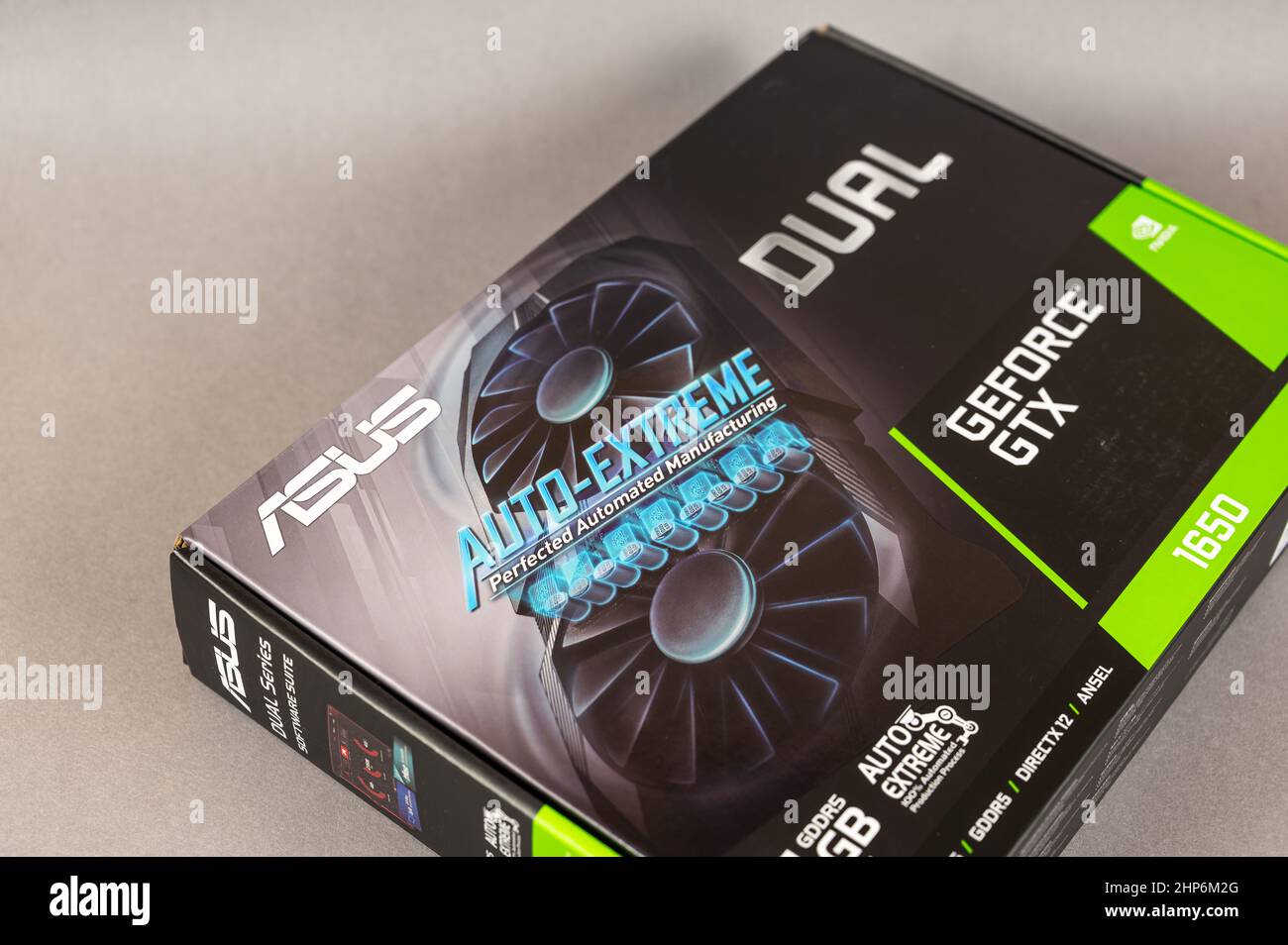 ASUS GFORCE GTX 1650 graphics card against a gray background. Modern ...