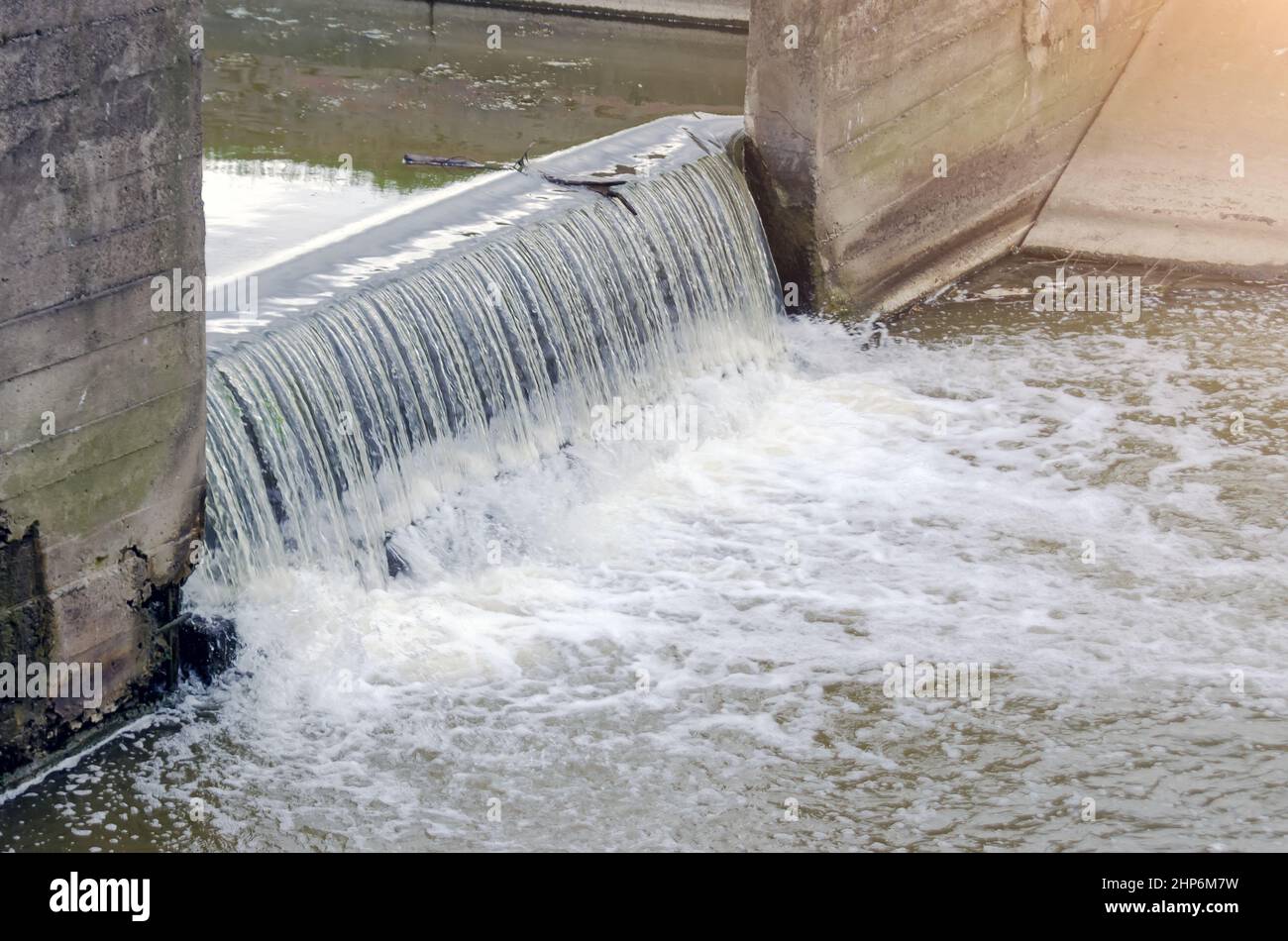 Sewer city dirty waters in the canal merge waterfall Stock Photo - Alamy