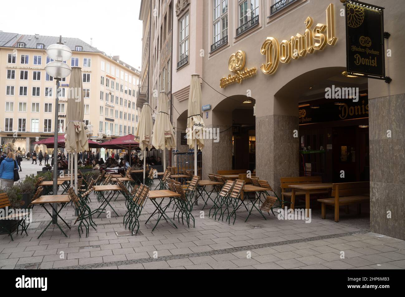 Munich, Germany. 19th Feb, 2022. Folded chairs and tables in front of ...