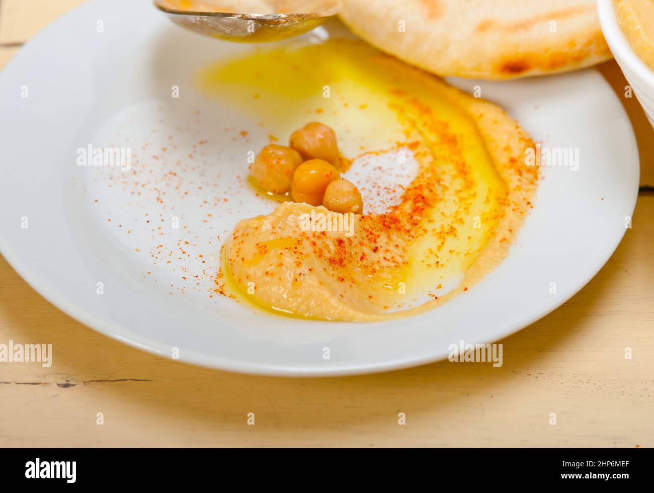 traditional chickpeas Hummus with pita bread and paprika on top Stock ...