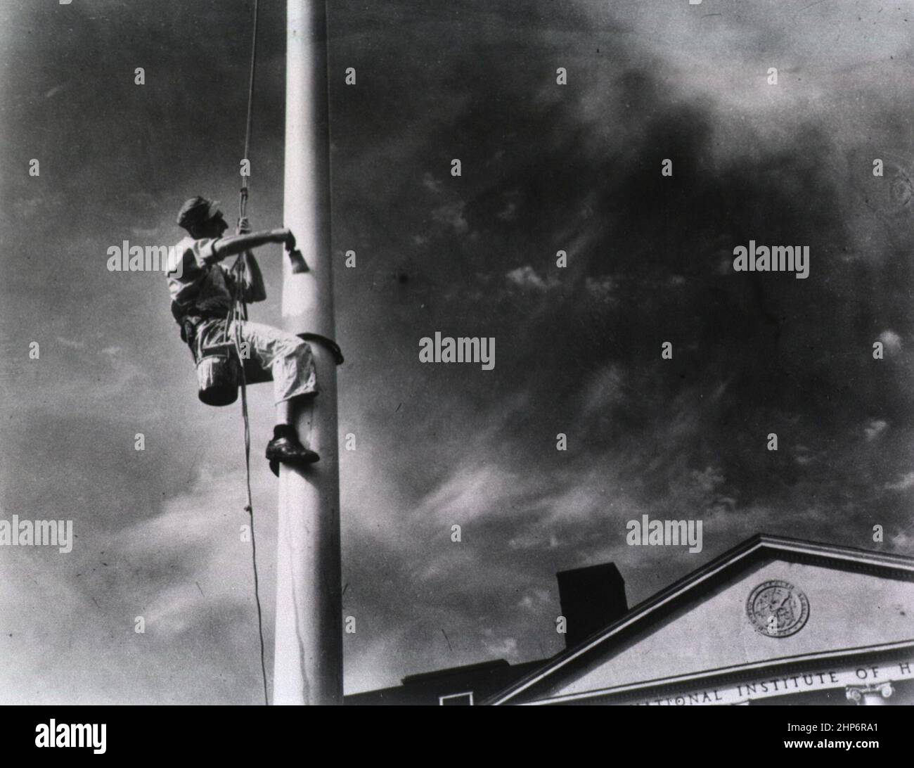 This 1938 photo shows the flagpole being painted in front of the iconic ...