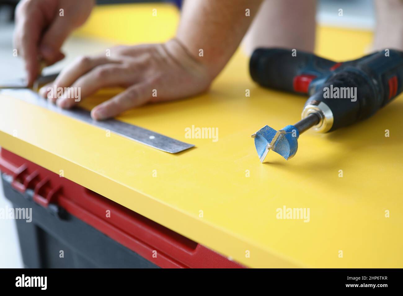 Hands measure the distance with ruler on the board Stock Photo - Alamy