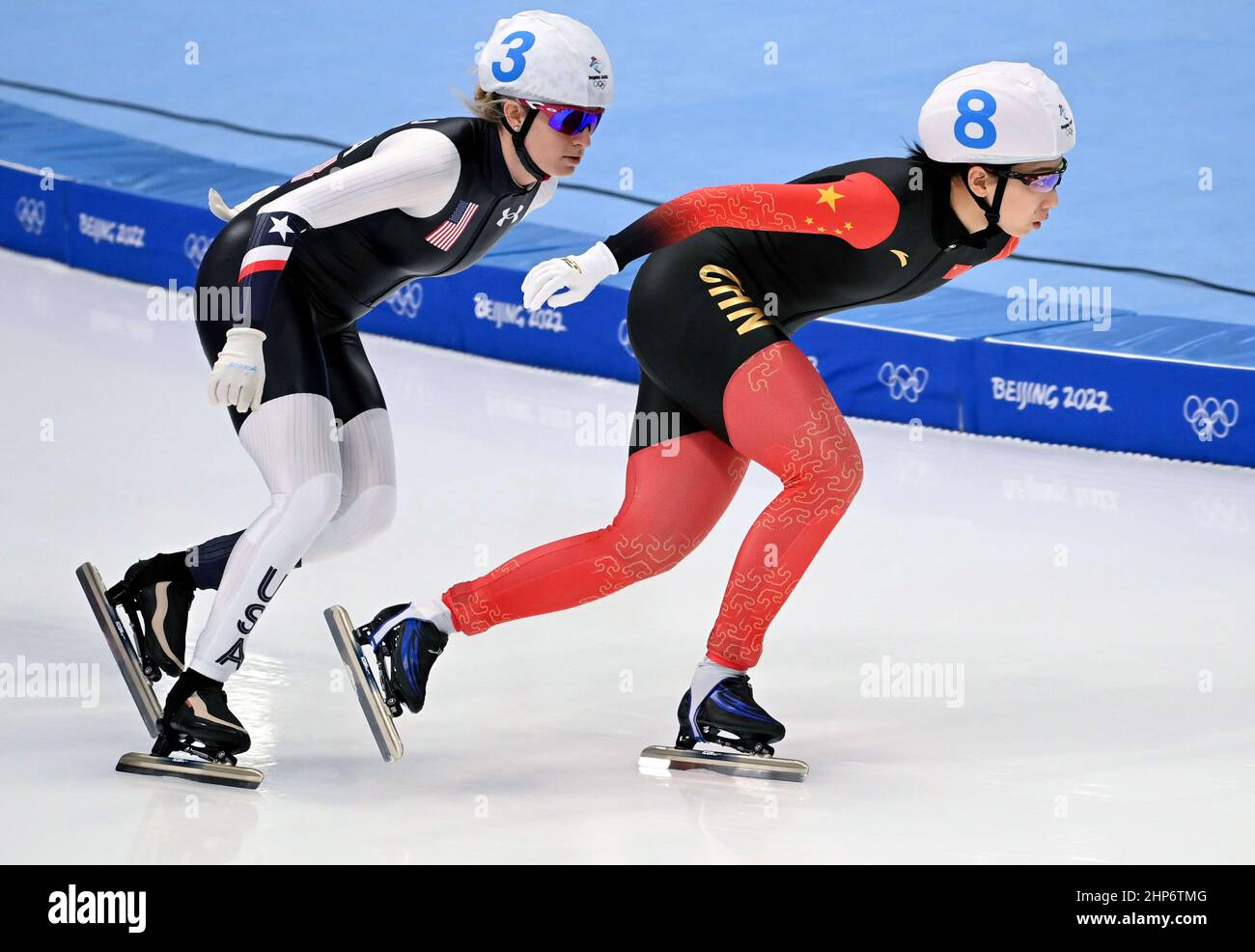 Beijing, China. 19th Feb, 2022. Li Qishi (R) of China competes during ...