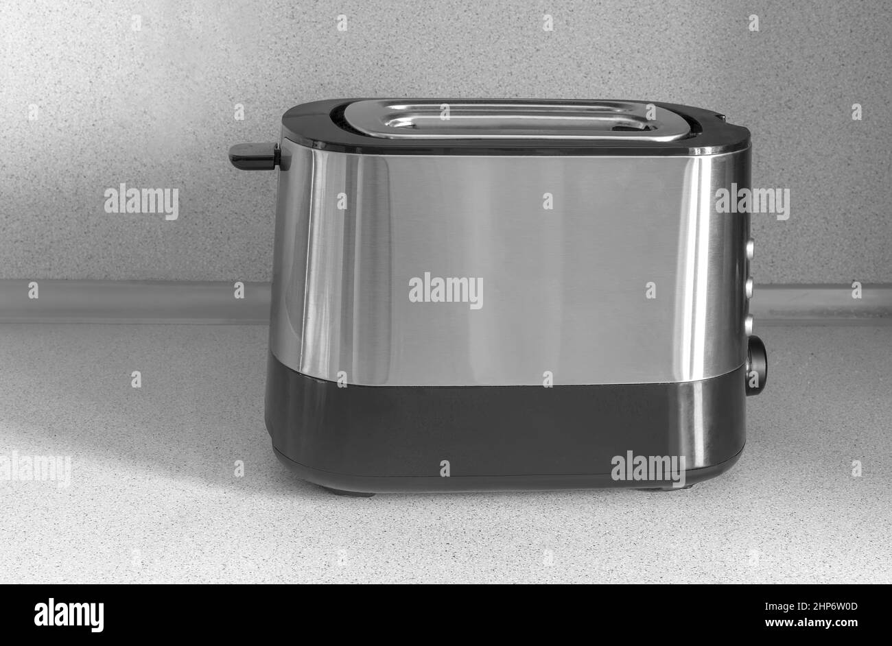 Modern electric toaster for white bread on the kitchen table. I make ...