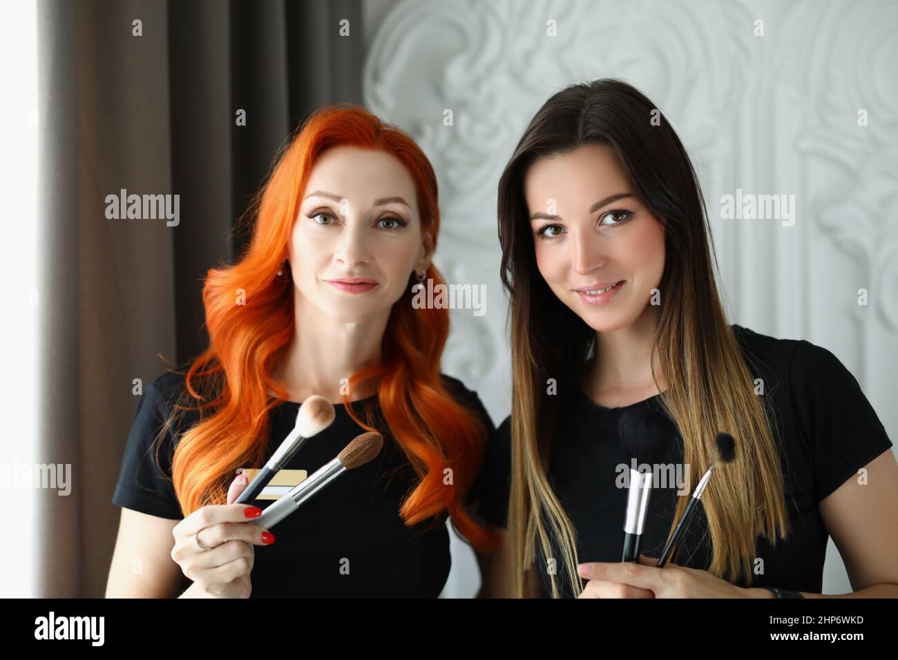 Beautiful young female employees of a beauty salon Stock Photo - Alamy