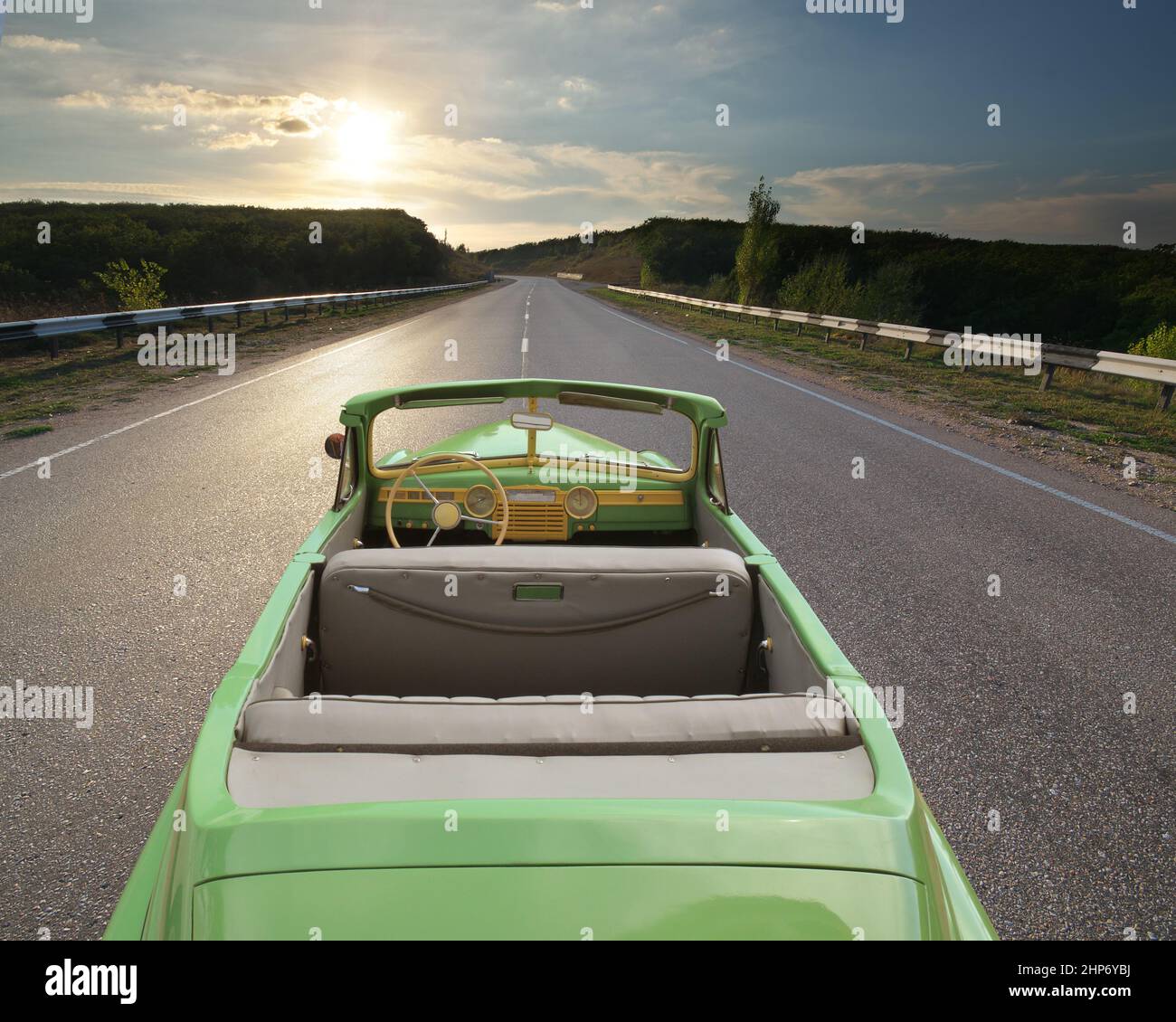 Retro car on real road. Conceptual idea design Stock Photo - Alamy