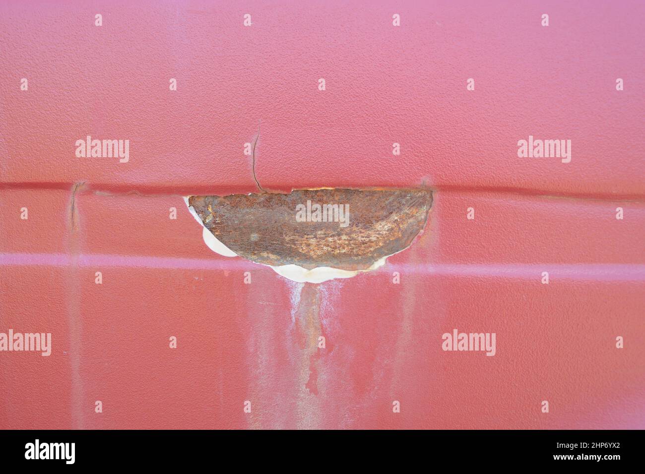 Peeling paint on the car body. Rust under putty. Concept of improper ...