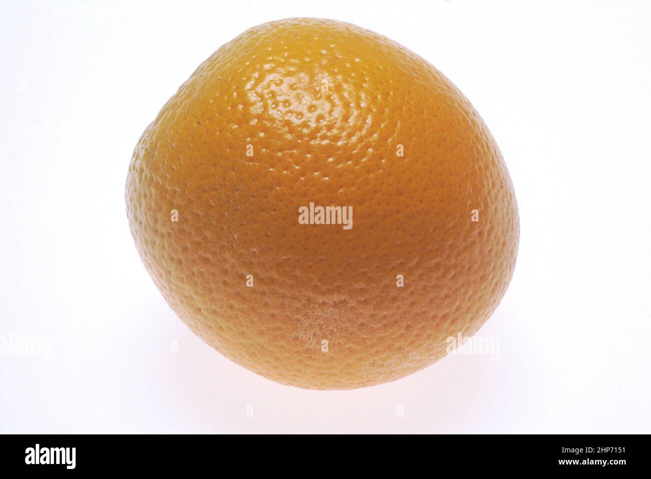 A whole unpeeled orange Stock Photo - Alamy