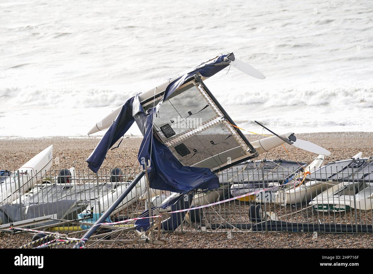 A catamaran washed up along the seafront in Brighton, Sussex, after ...