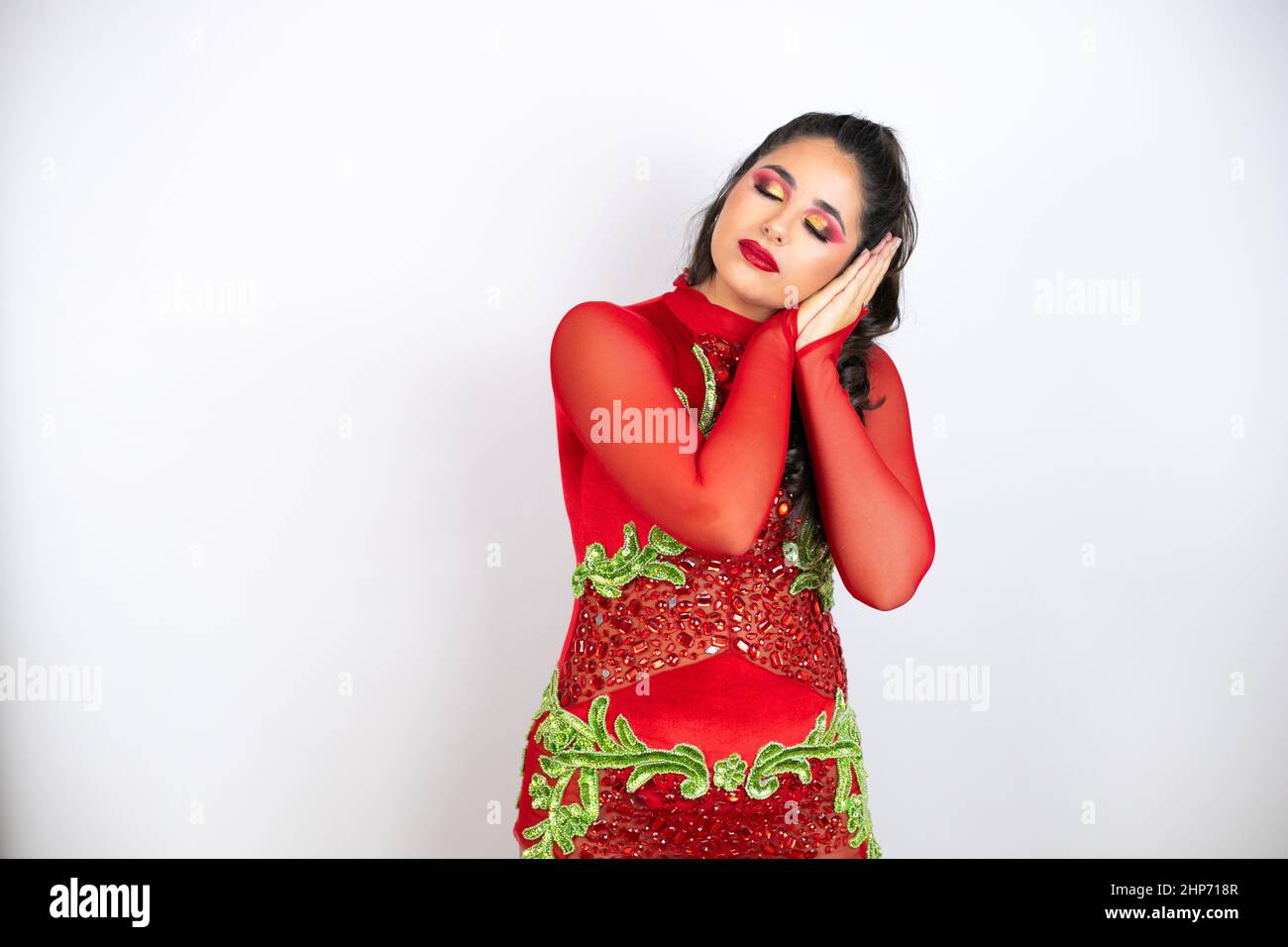 Young beautiful woman wearing carnival costume over isolated white ...