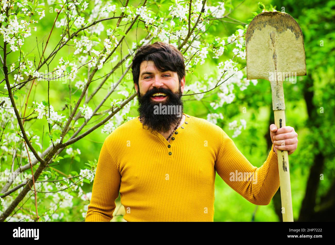 Happy man with shovel preparing to planting. Gardener work. Spring ...