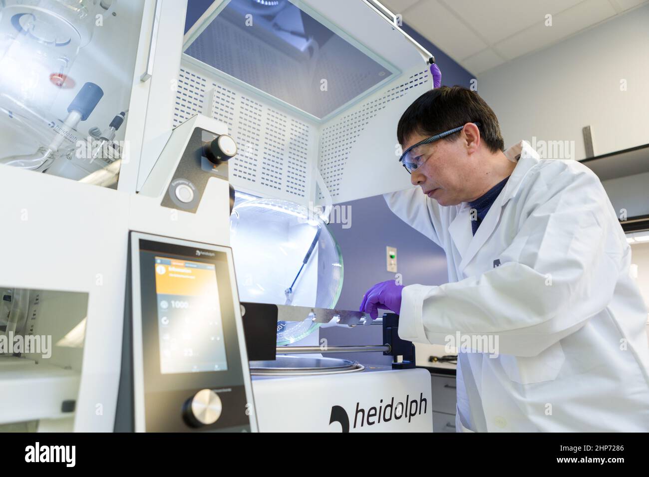 Victor Ding operates a rotary evaporator in the Process Chemistry Lab ...