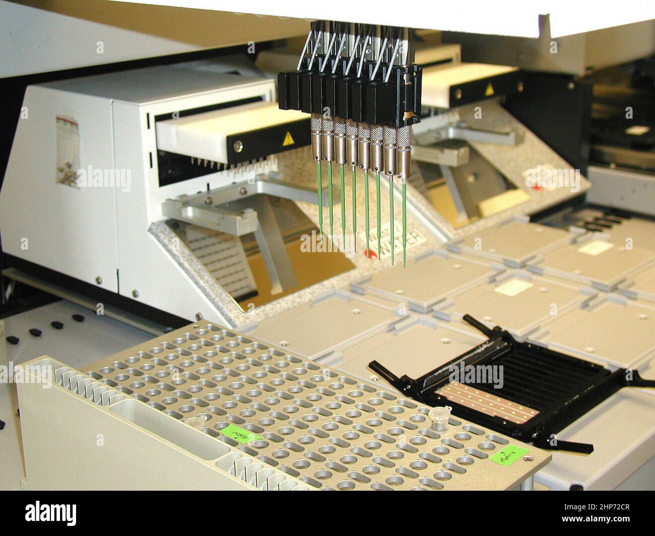 A TECAN Genesis 2000 robot prepares Ciphergen SELDI-TOF protein chips ...