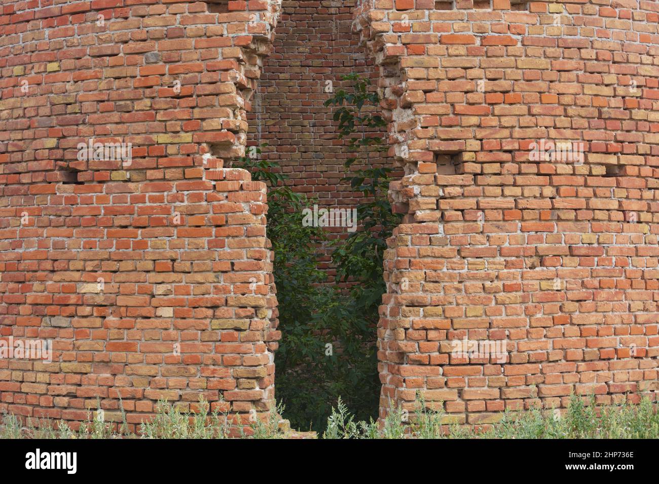 Break in an old brick wall. Large crack in the water tower Stock Photo ...