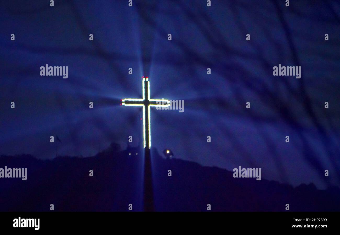 light bright Christian cross at night Stock Photo - Alamy