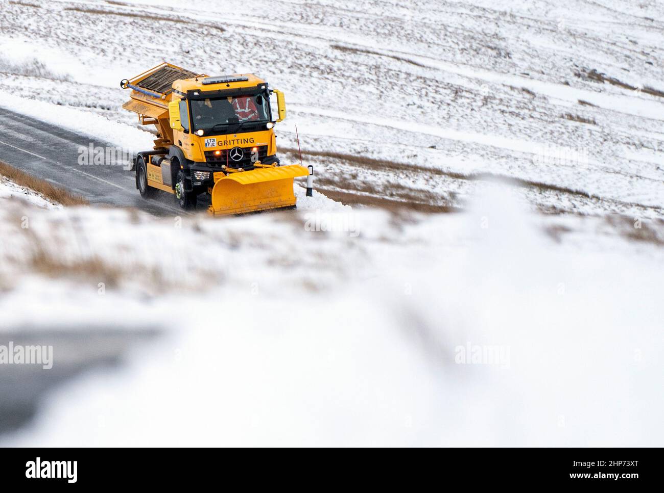 A snow plough on the Buttertubs Pass near Hawes, North Yorkshire, after ...