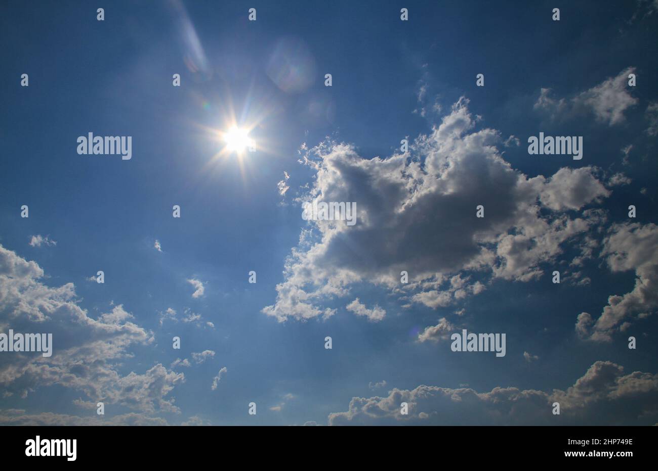 natural clouds blue sky sun ray light Stock Photo - Alamy