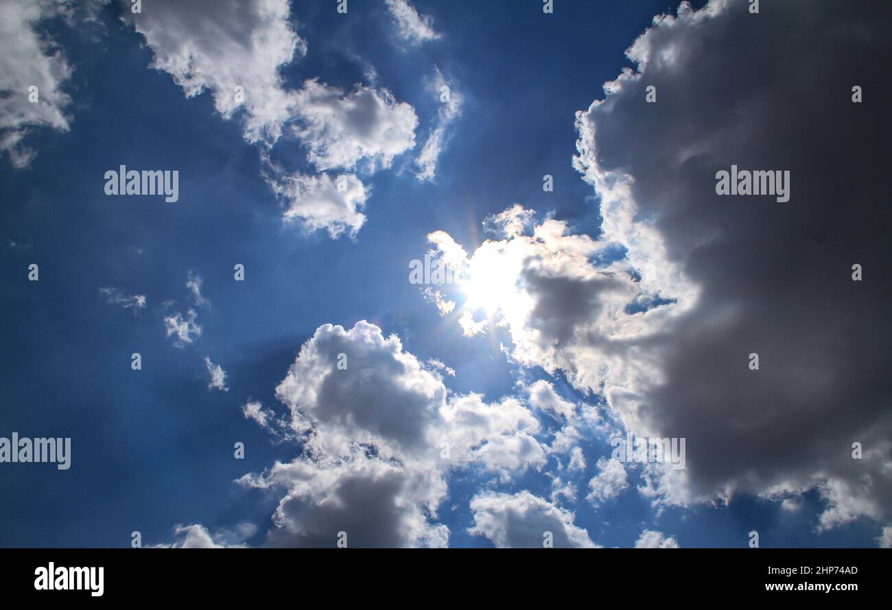 natural clouds blue sky sun ray light Stock Photo - Alamy