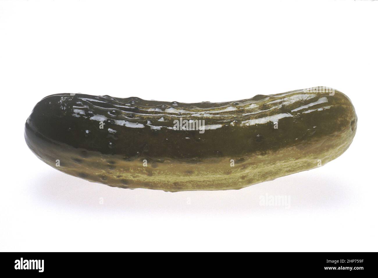 One whole, deli dill pickle Stock Photo - Alamy