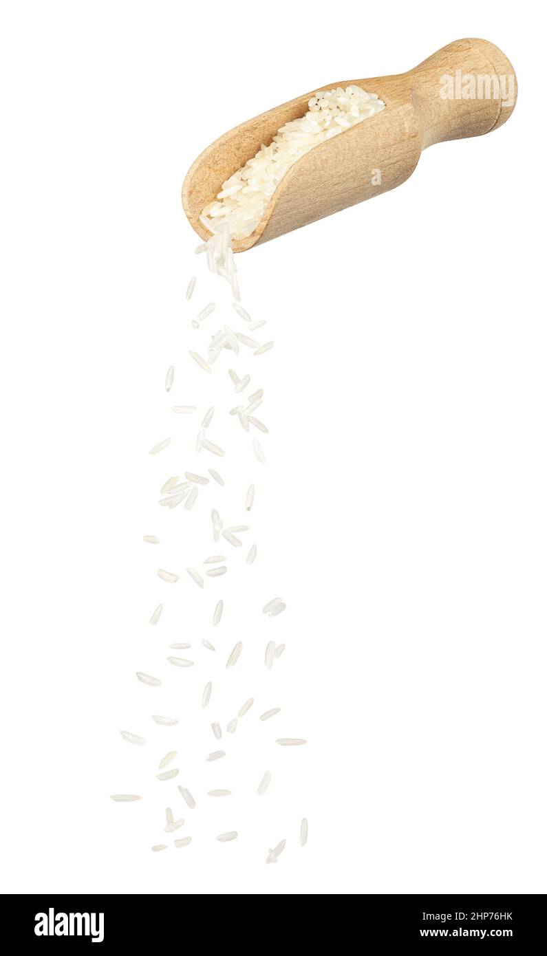 white rice falling from wooden scoop isolated Stock Photo - Alamy