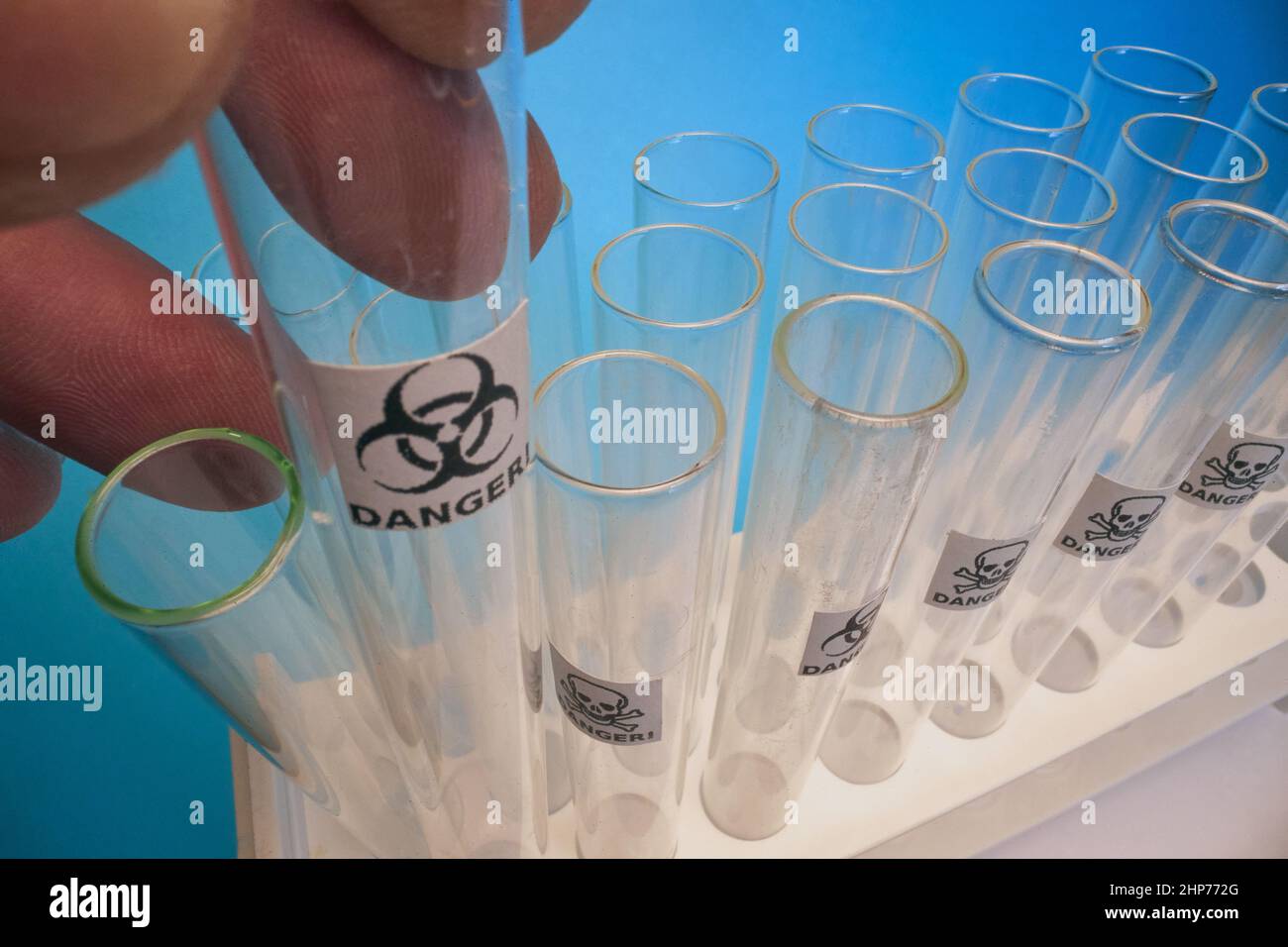 Macro view of test tube being taken by hand from the stand in the ...