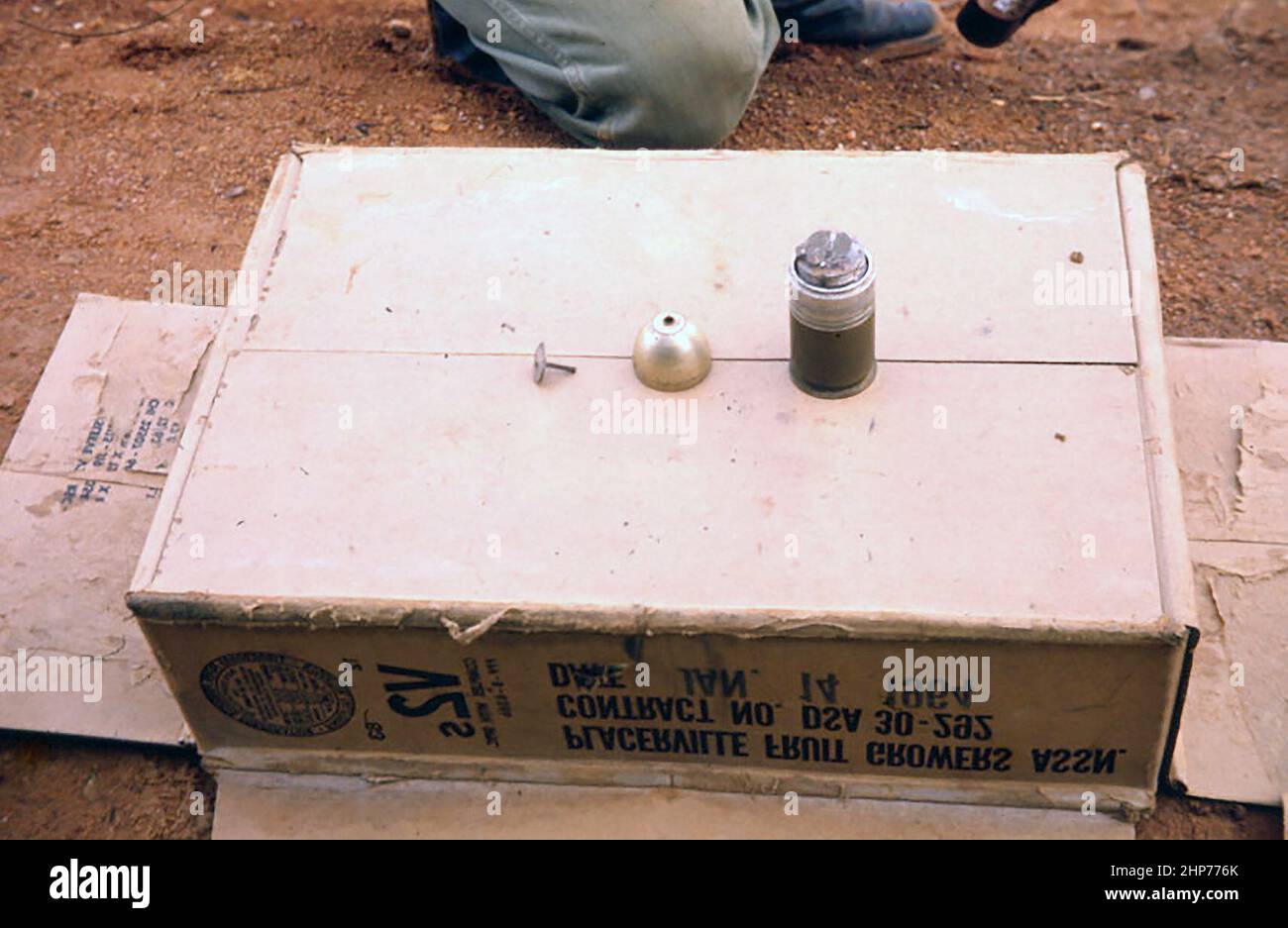 This shows the M-79 round booby trap re-assembled. It is installed by ...