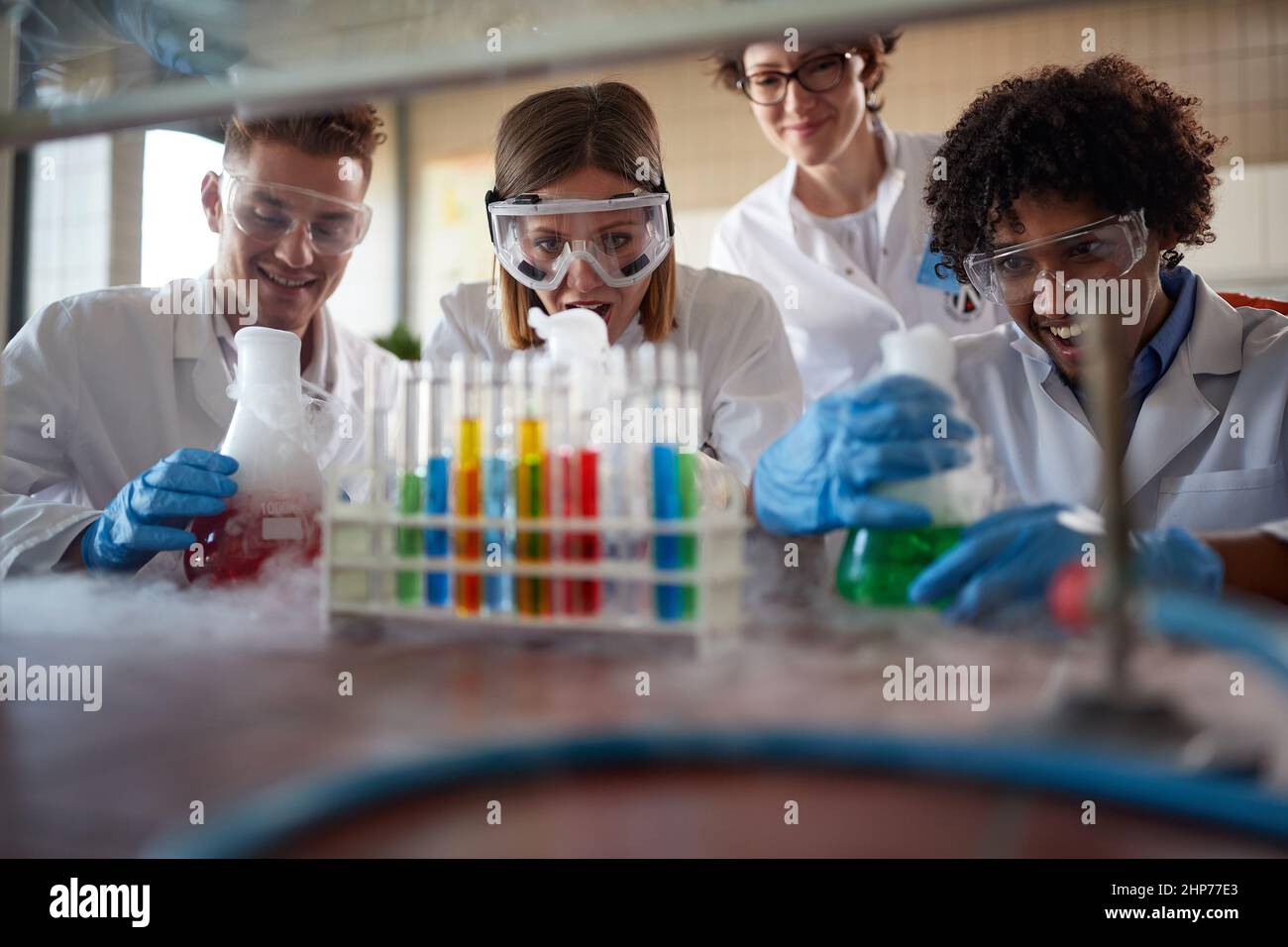 Young chemistry students in a laboratory relaxed atmosphere are full of ...