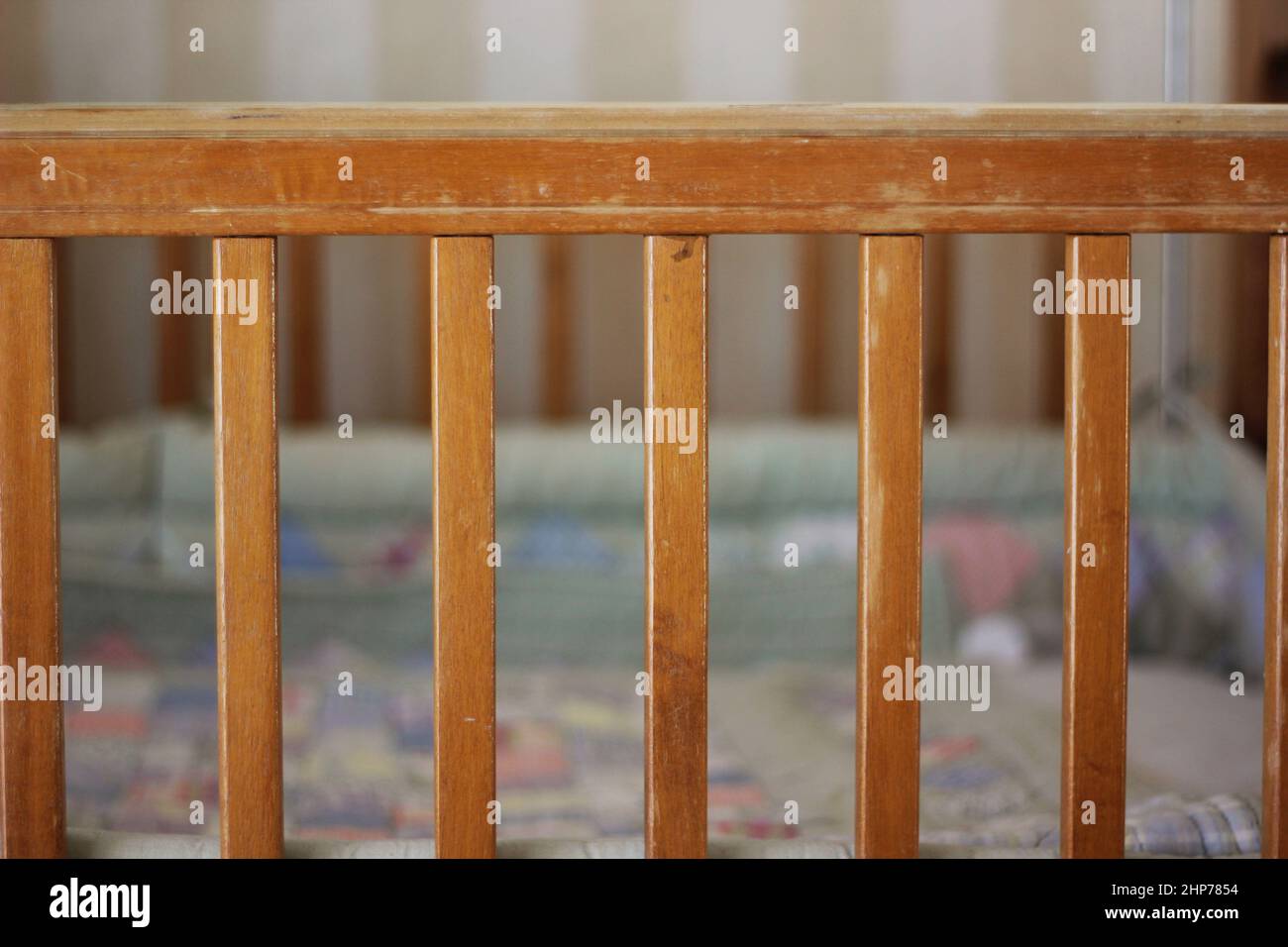An old vintage wooden baby crib with vertical wooden slats Stock Photo ...