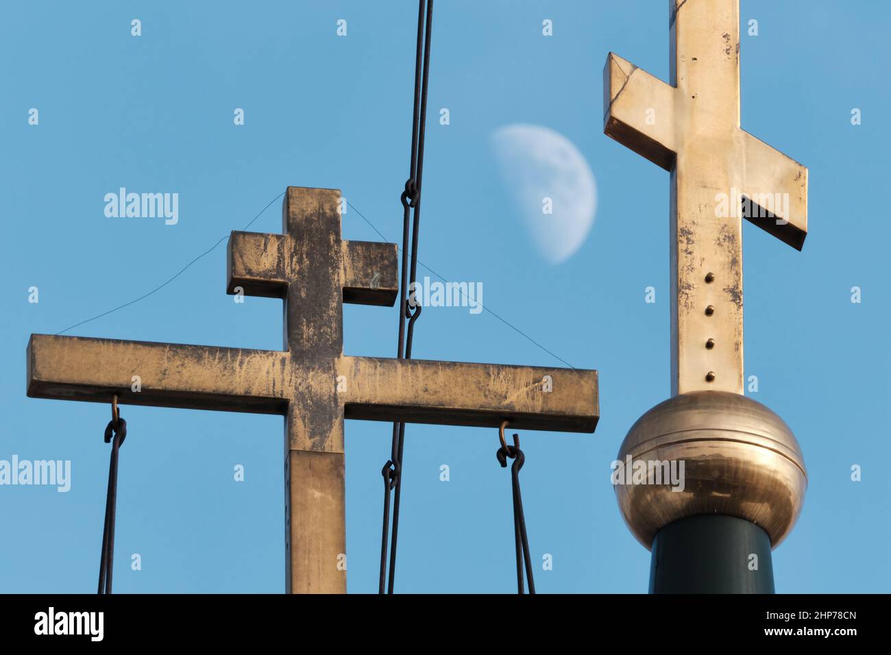 Russia. Moscow. Orthodox cross and waxing gibbous moon in daylight ...