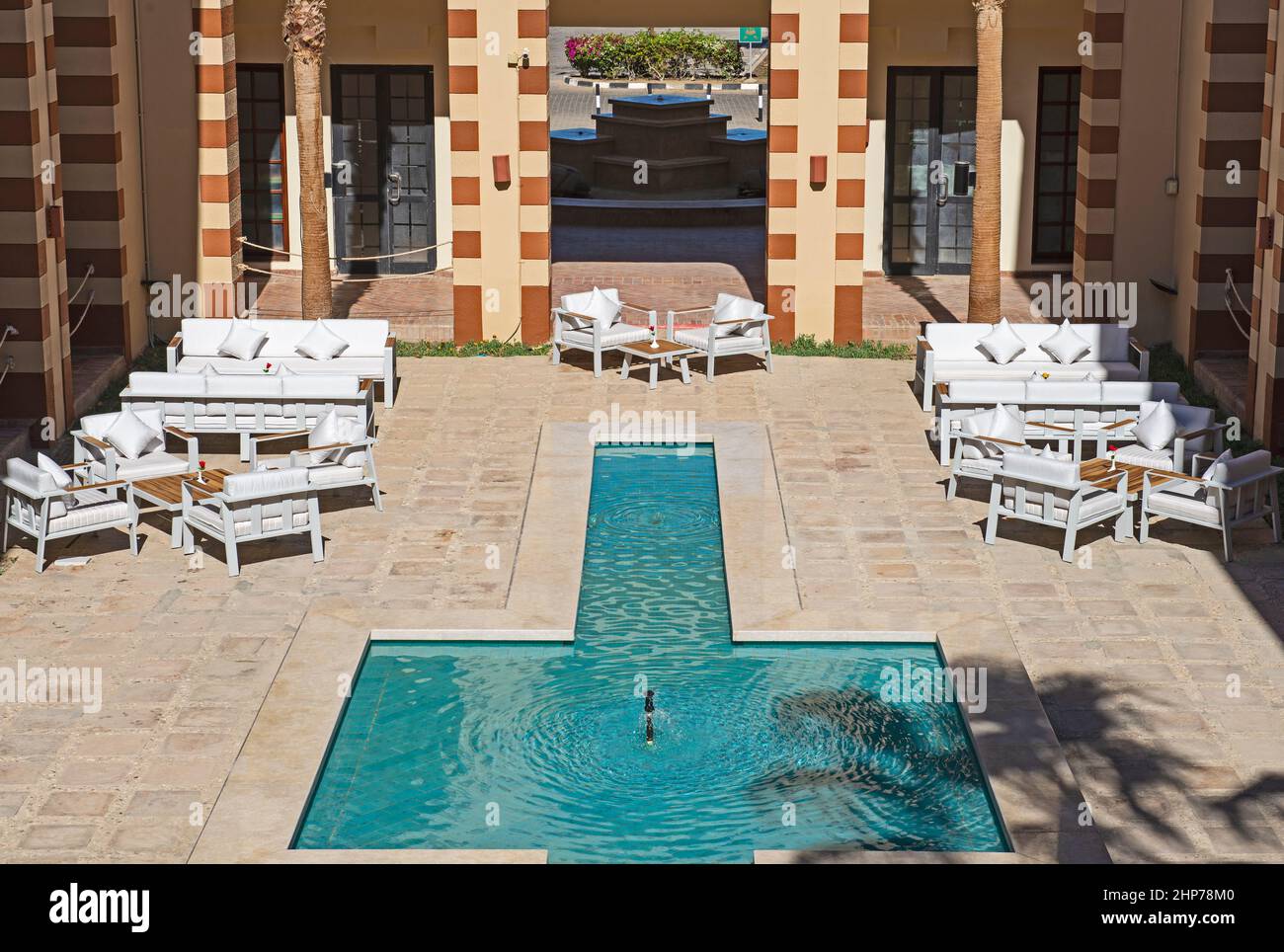 Outdoor patio terrace seating cafe area with table and chairs at ...