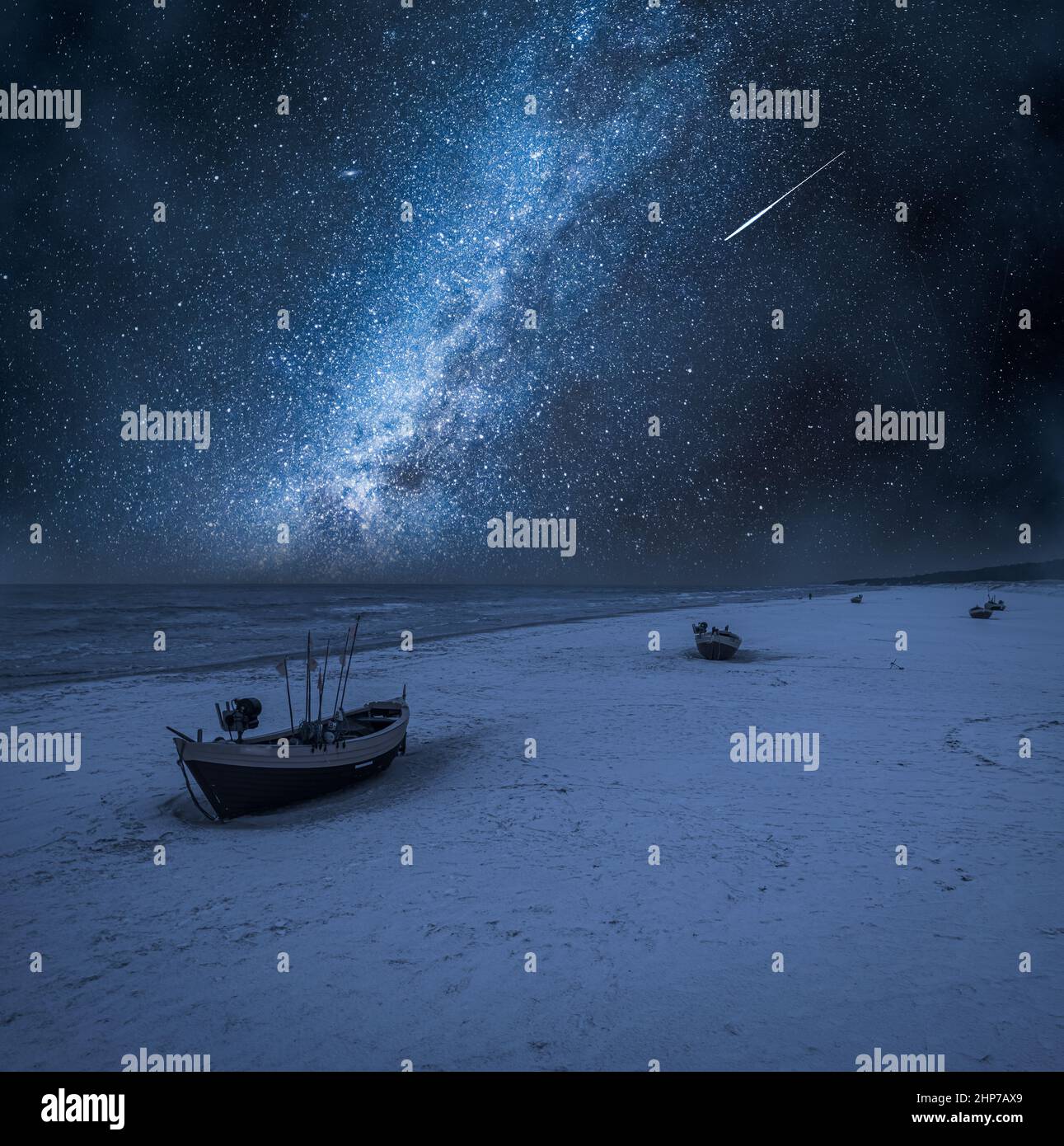 Milky way and falling stars over boats by Baltic Sea. Baltic Sea in ...
