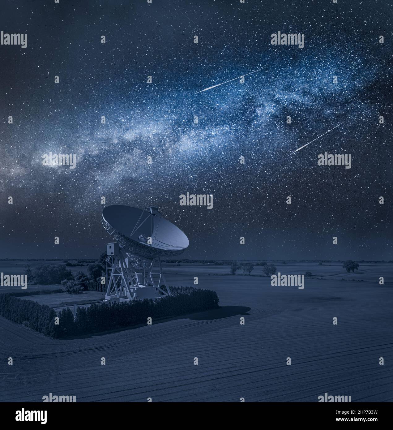 Astronomical observatory and milky way with falling stars above at ...