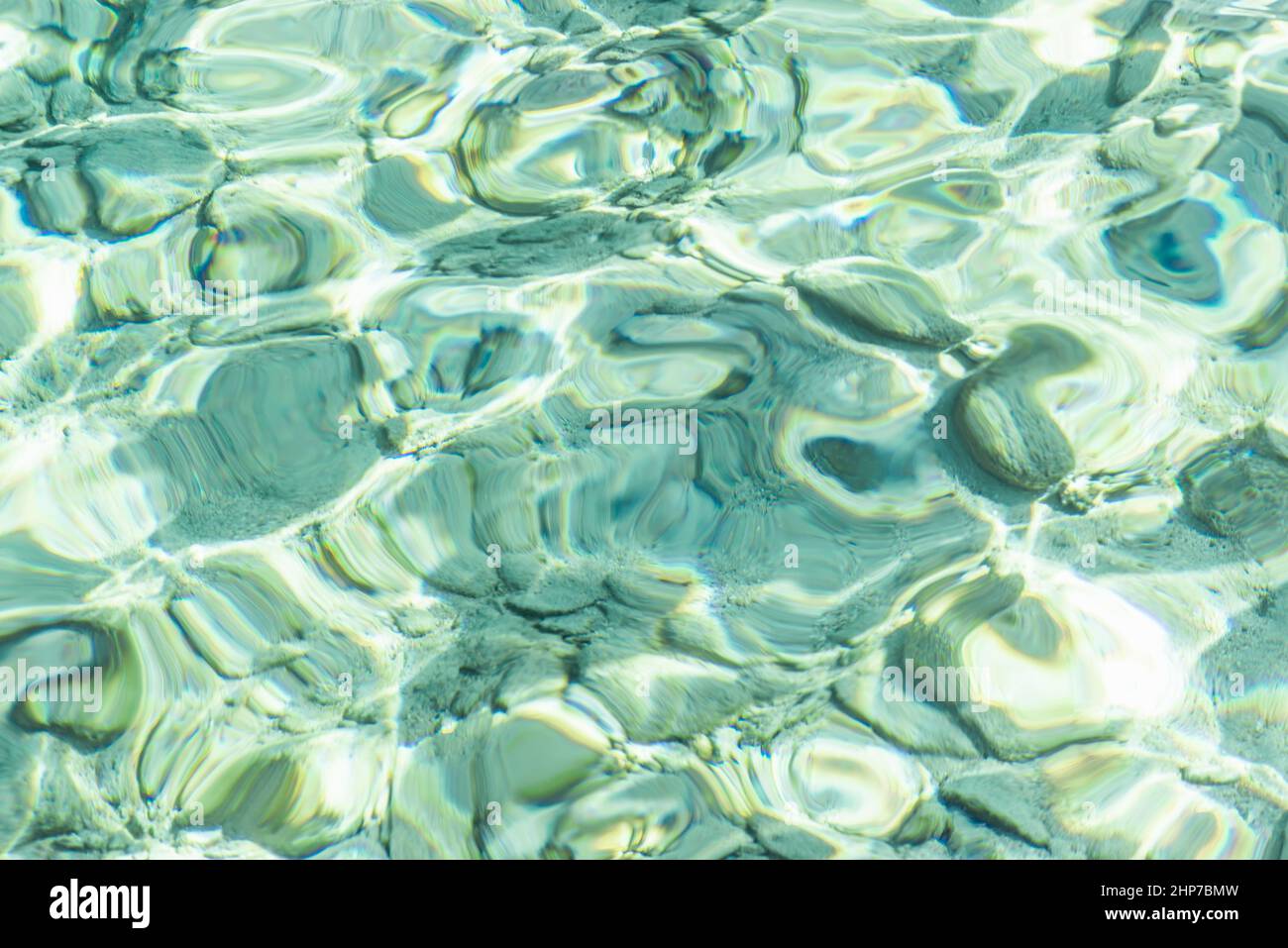 Underwater shallow waves rippling bright blue green water in a sea ...