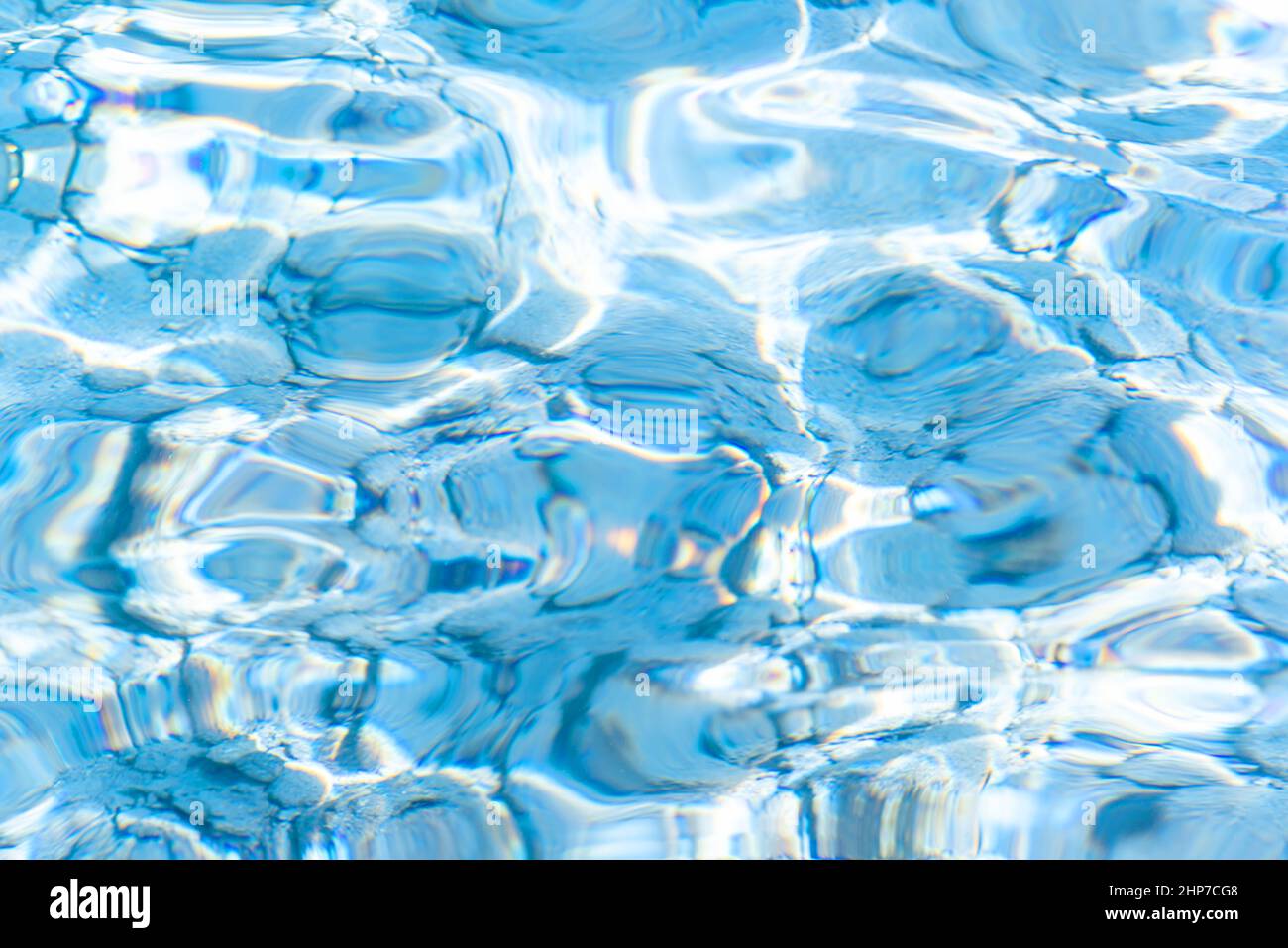 Underwater shallow waves rippling bright blue water in a sea background ...