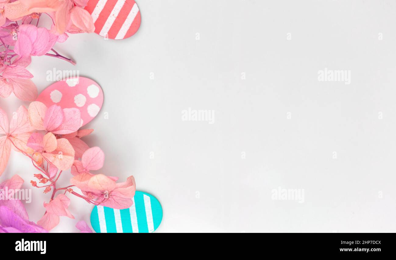 Colorful easter eggs and flowers. Border design with pink spring ...