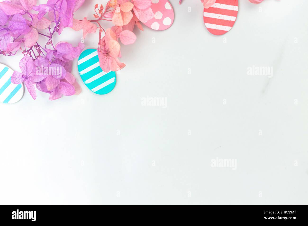 Colorful easter eggs and flowers. Border design with pink spring ...