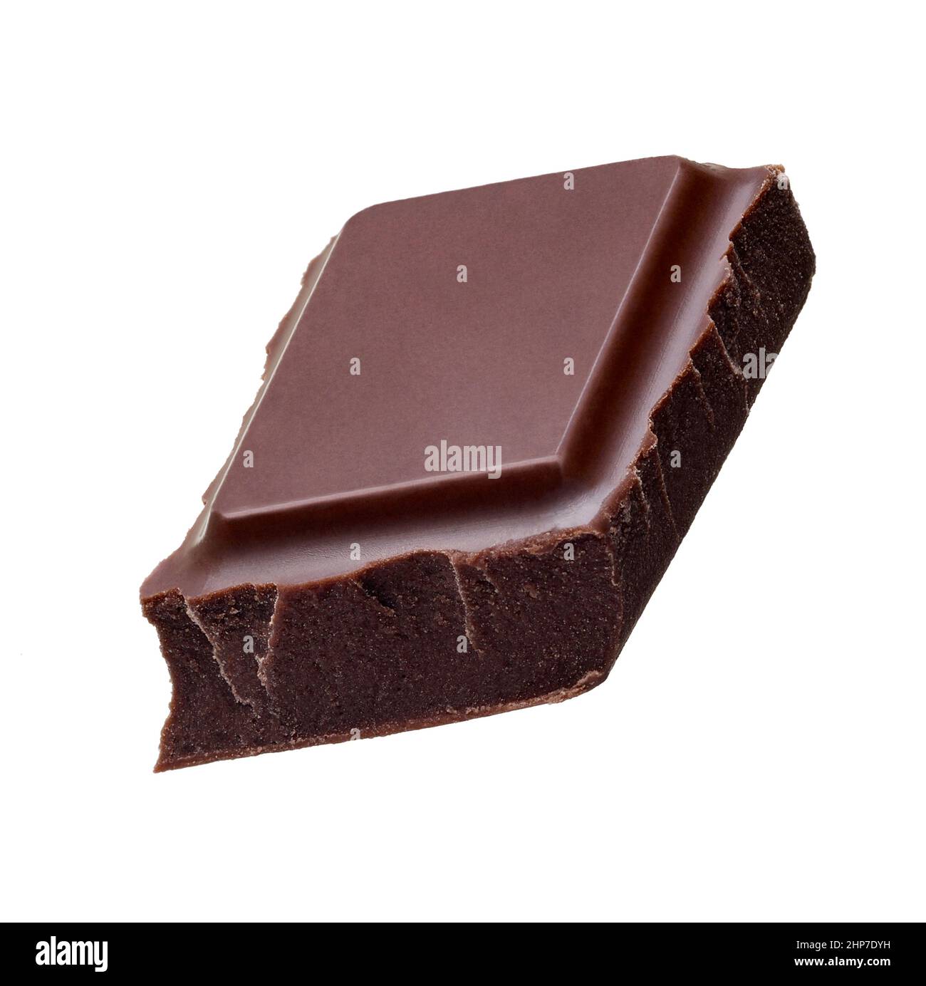 close up of chocolate pieces stack falling on white background Stock ...