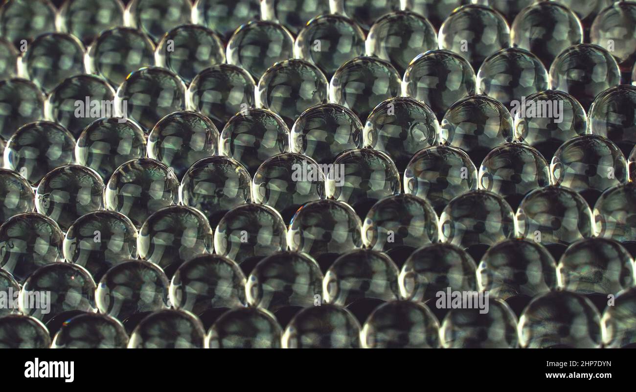 Hydrogel round gel balls. Abstract geometric dark background. Macro of ...