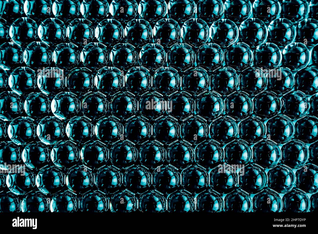 Black geometric abstract background of gel balls. Macro of dark blue ...