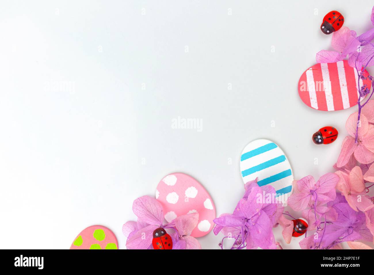 Colorful easter eggs and flowers. Border design with pink spring ...