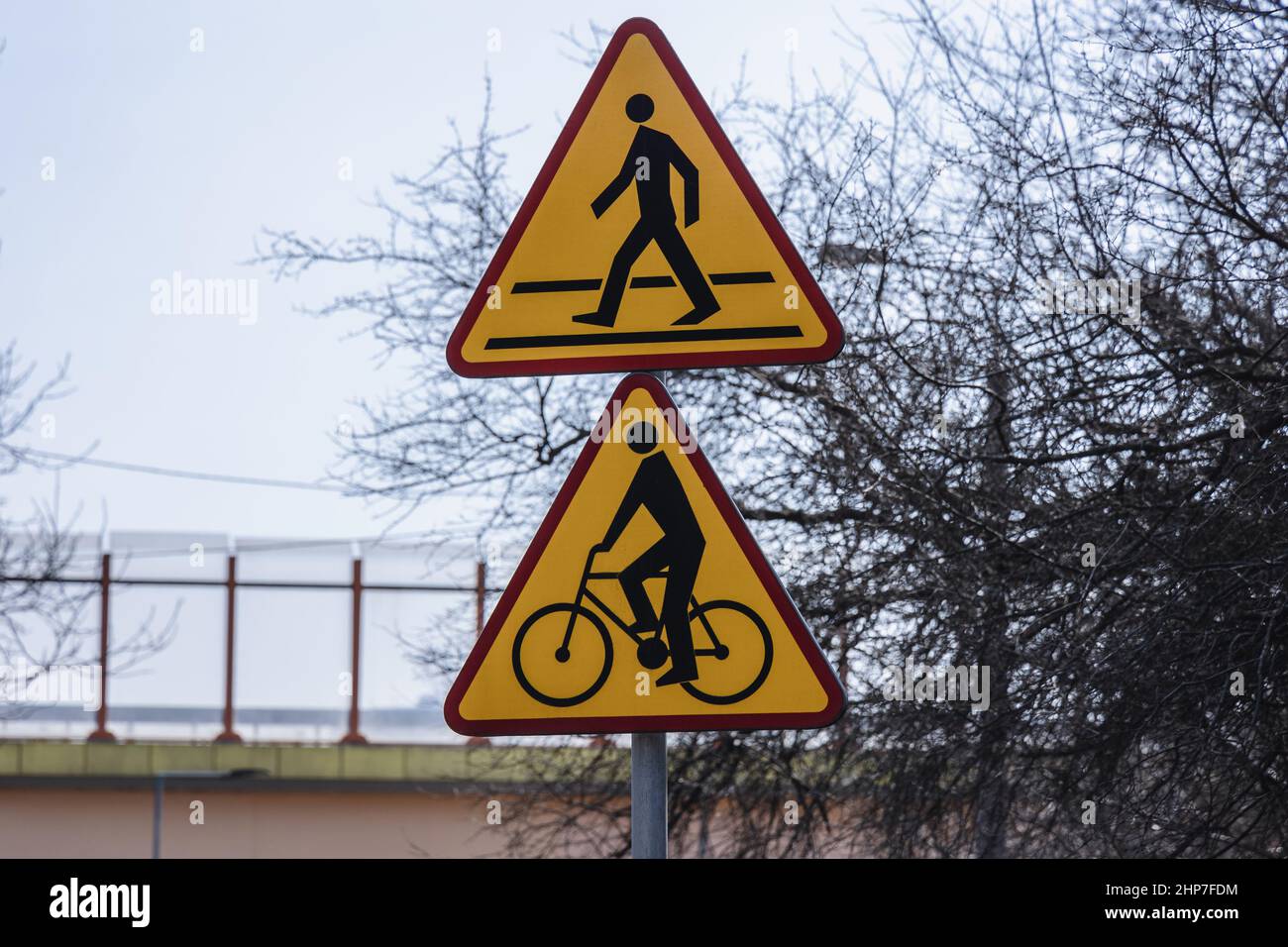 Warning sign for pedestrian crossing and bicycle path in Warsaw ...