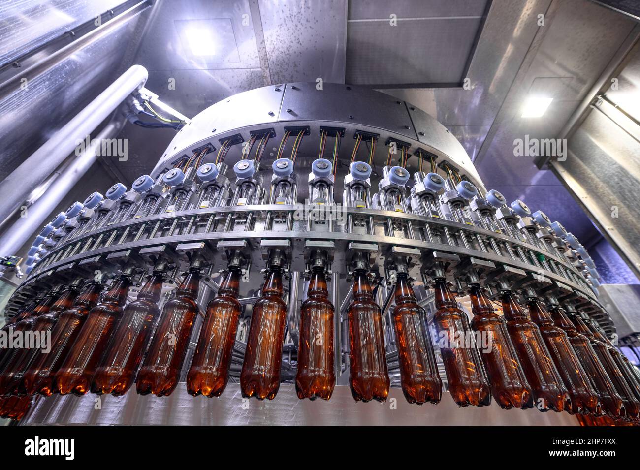 Automatic filling machine, the process of filling plastic bottles with ...