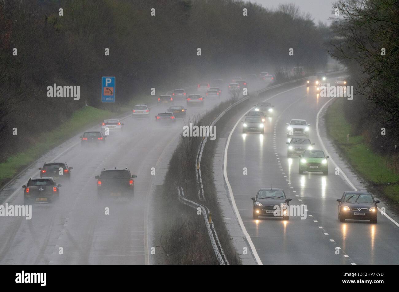 Cars make their way through heavy rain on the A14 in Suffolk, after ...