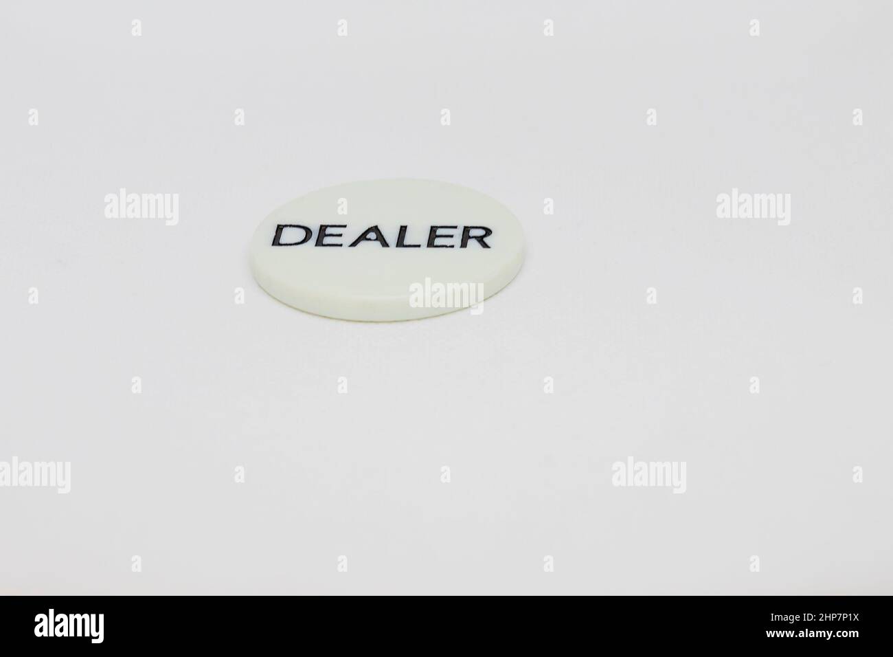 White plaque with the word dealer. The plaque is on a white background ...