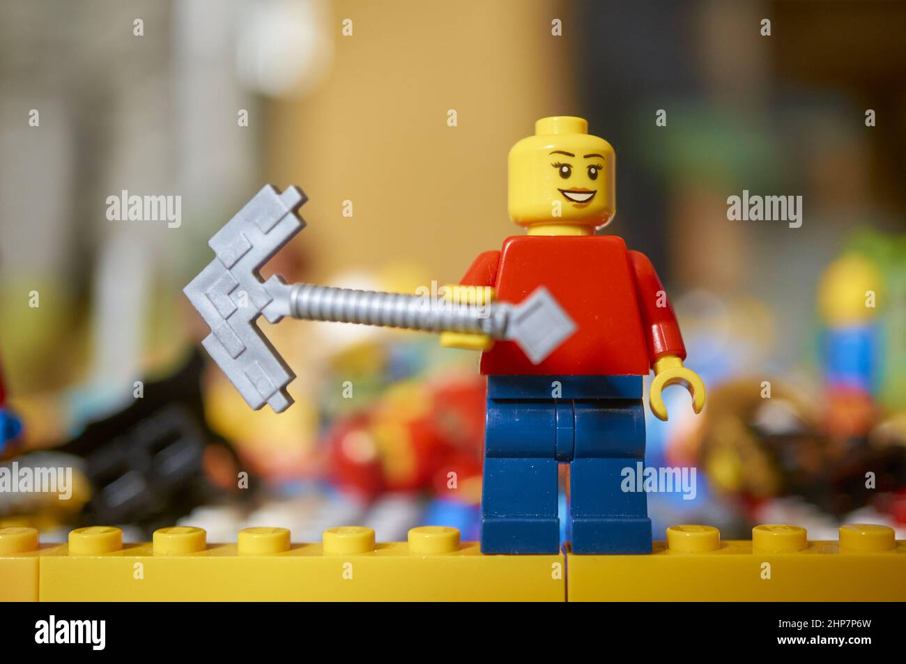 Lego brand woman toy figurine holding a large axe Stock Photo - Alamy